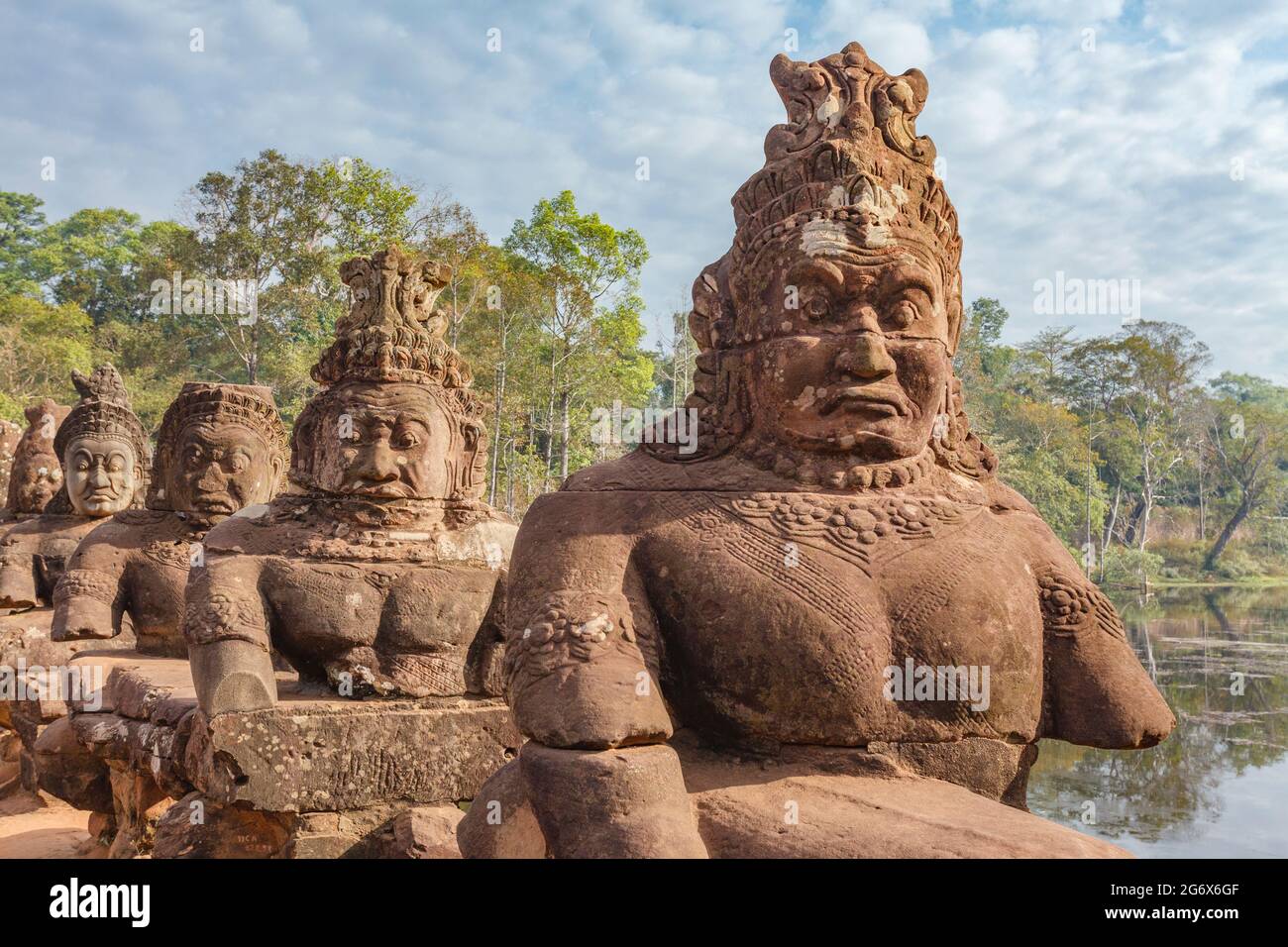 South gate of Angkor Thom along with a bridge of statues of gods and ...