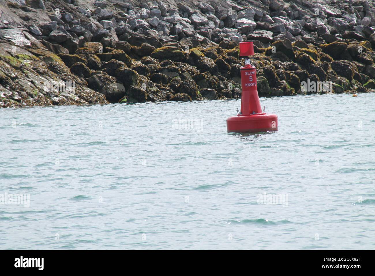 An Anchored Speed Restriction Buoy at a Sea Harbour Stock Photo - Alamy