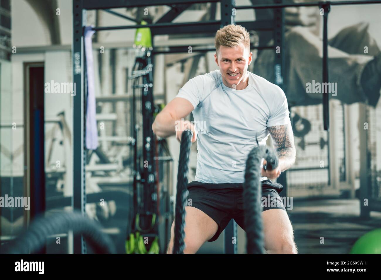 Handsome bodybuilder exercising battle hi-res stock photography and ...