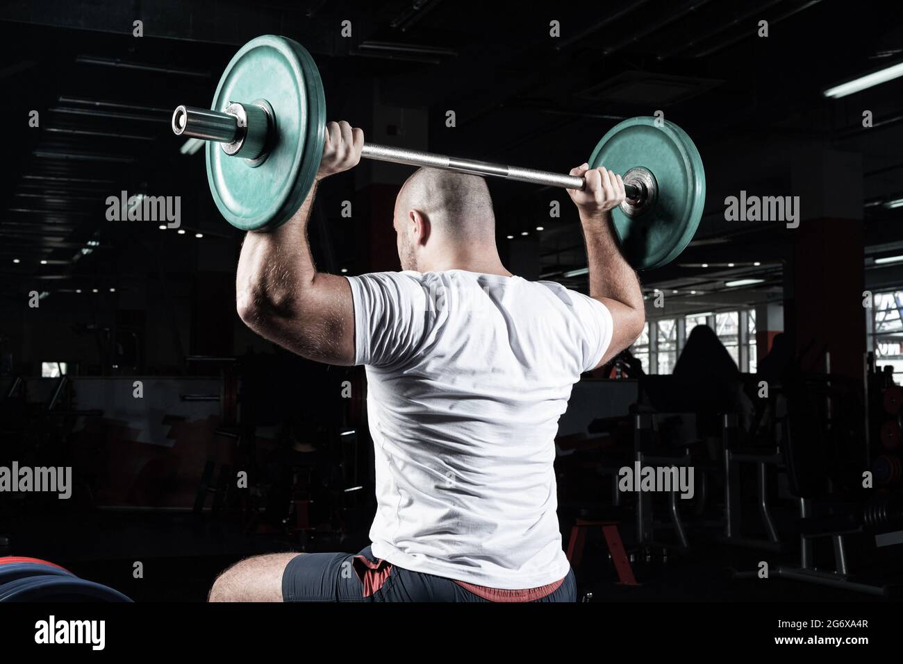 Young athlete lifts heavy barbell hi-res stock photography and images ...
