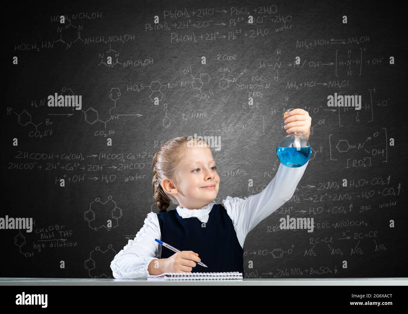 Little girl scientist examining test tube Stock Photo - Alamy
