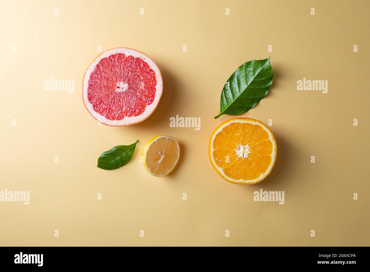 Citrus fruits on yellow golden background Stock Photo - Alamy