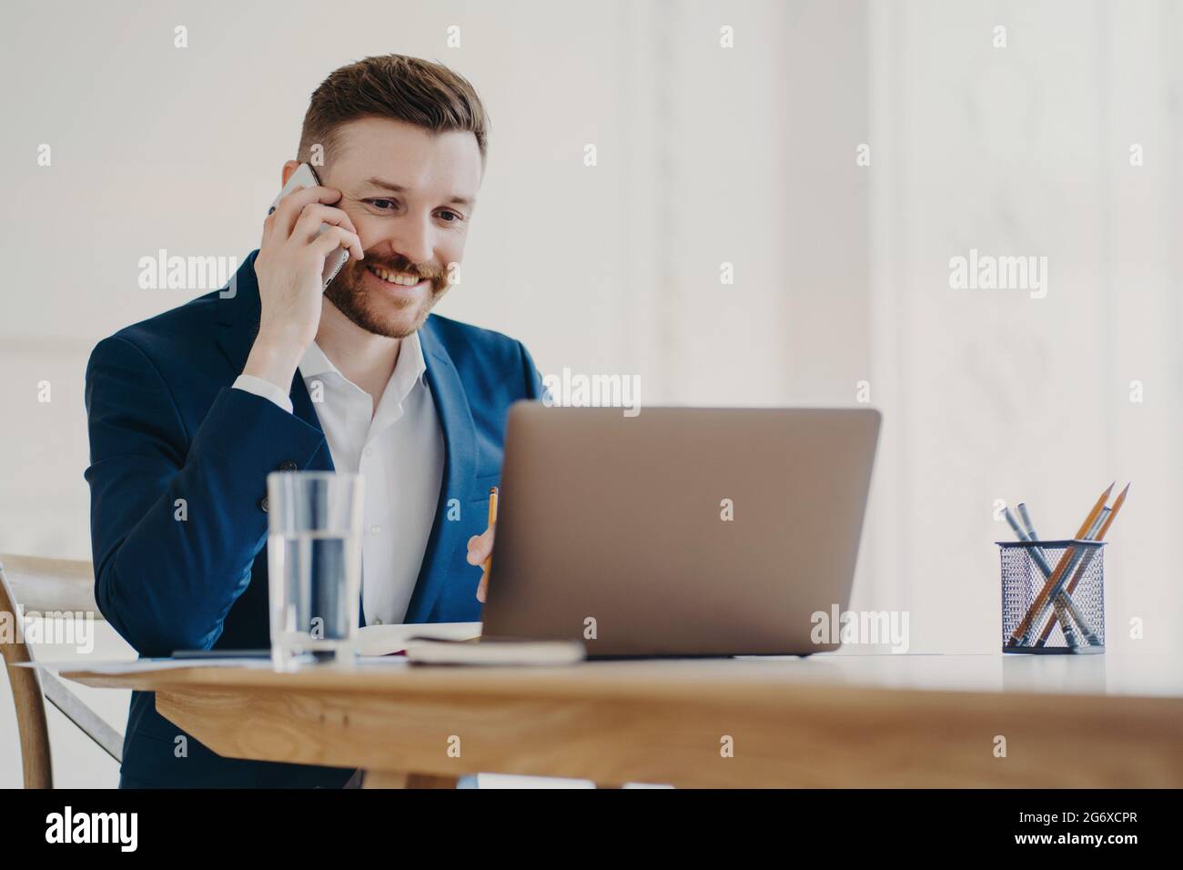 Boss sitting behind desk hi-res stock photography and images - Alamy