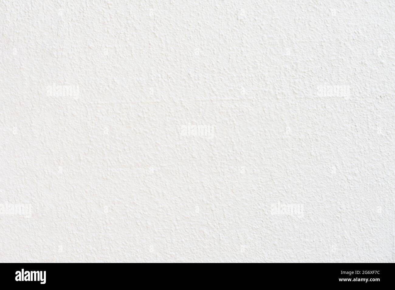White stucco wall background, painted cement wall texture, granular ...