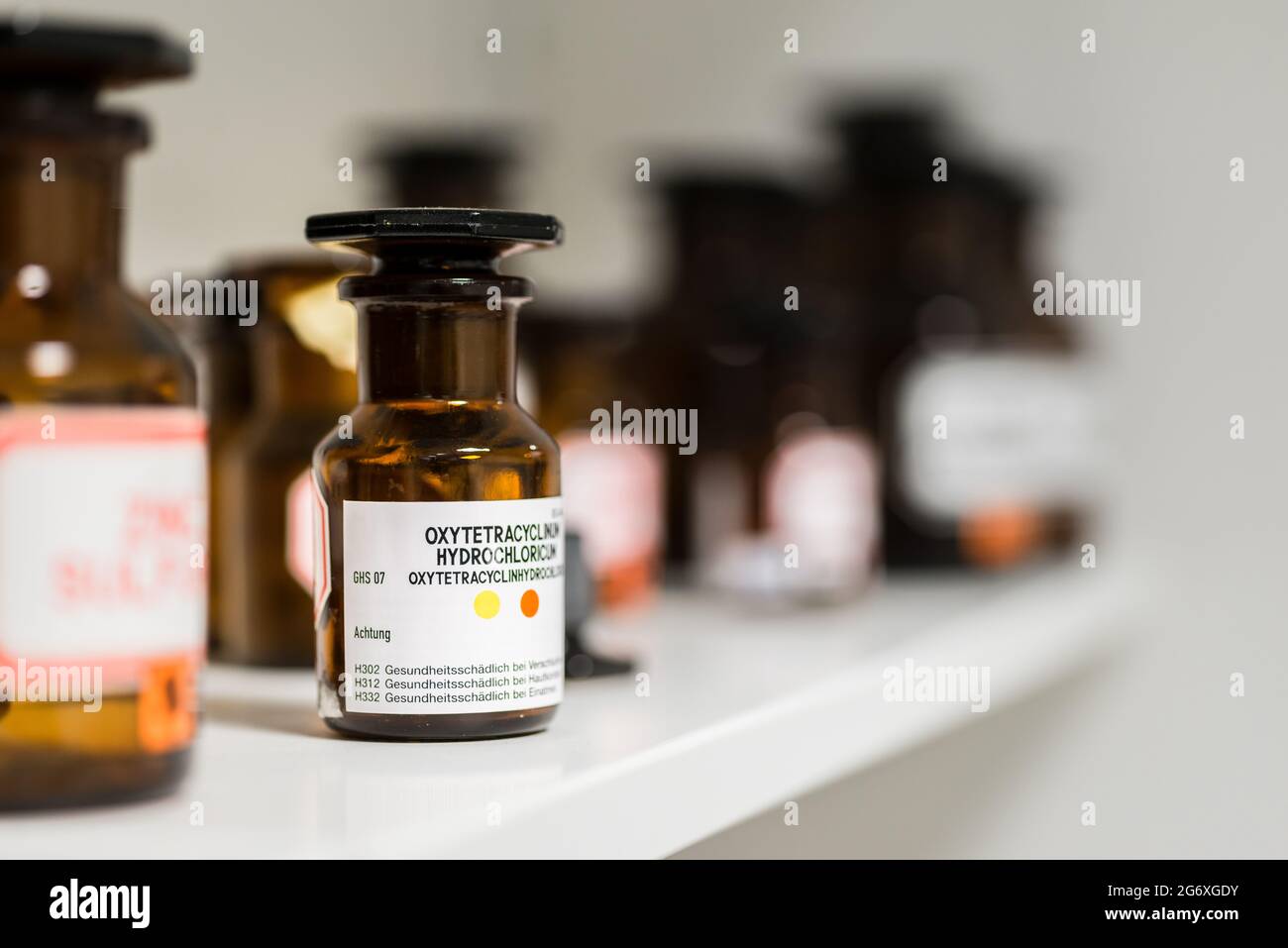 Close-up of the labeled glass container of a chemical pharmaceutical ...