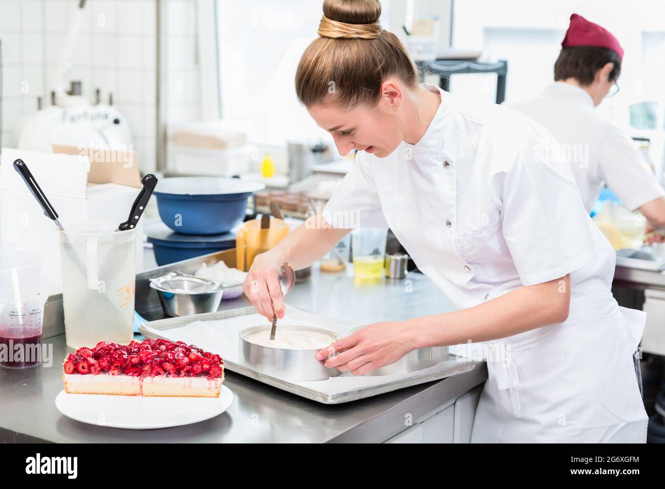 Women in pastry shop bakery making pies and cakes ready Stock Photo - Alamy