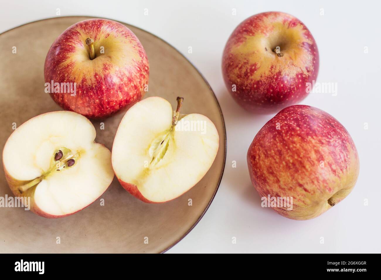 Apples and cups with plates on a grey background. Concept of healthy ...