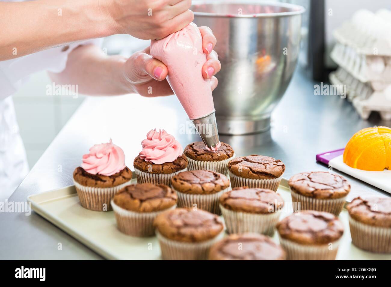 Female baker glazing dessert hi-res stock photography and images - Alamy