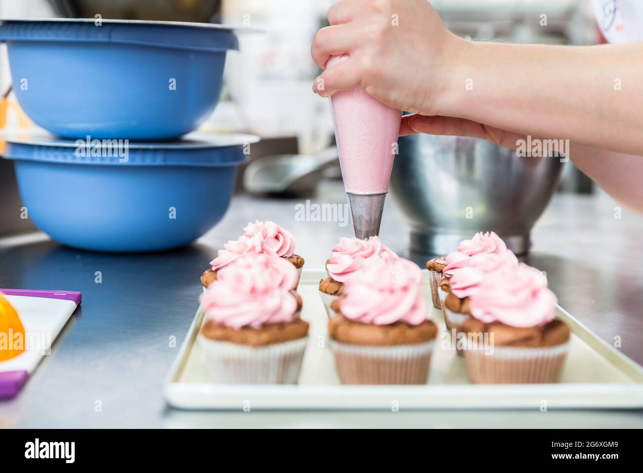 Female baker glazing dessert hi-res stock photography and images - Alamy