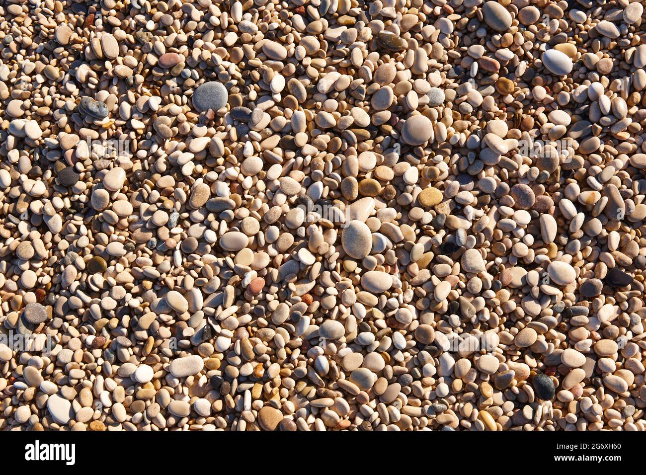Mediterranean shoreline peeble beach. Natural textured background ...
