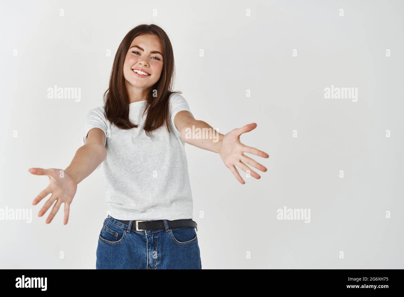 Beautiful slim woman reaching out, stretching hands forward to hold you ...