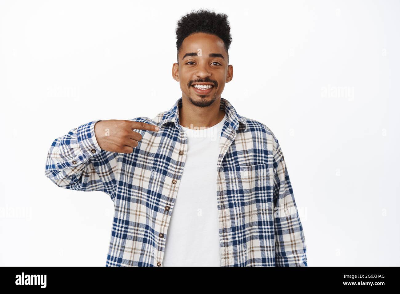Portrait of african american young man pointing at himself, smiling ...