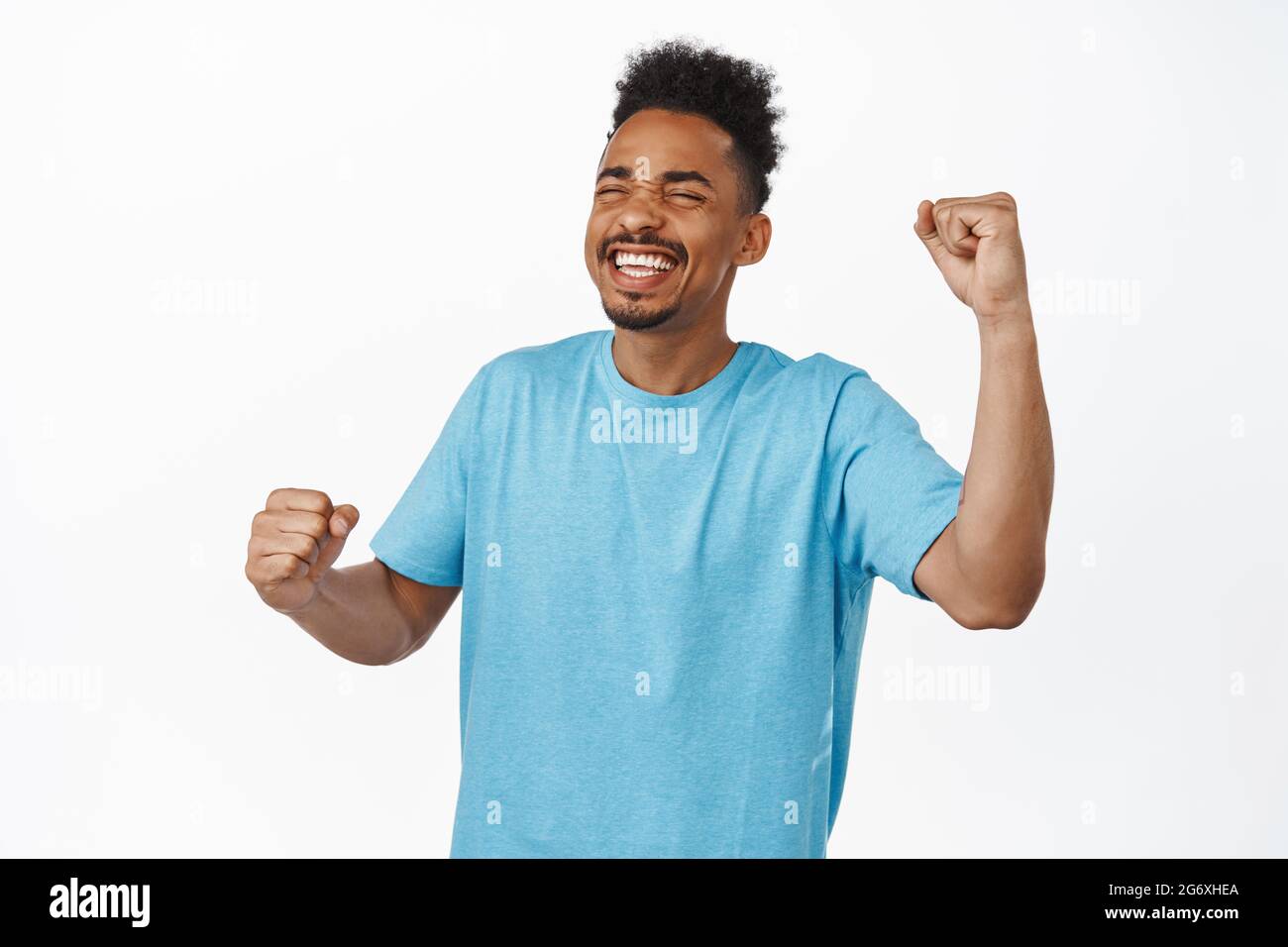 Success. Happy african american guy, sport fan chanting, smiling ...