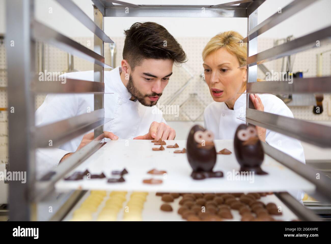 working with eggs in the chocolate factory Stock Photo - Alamy