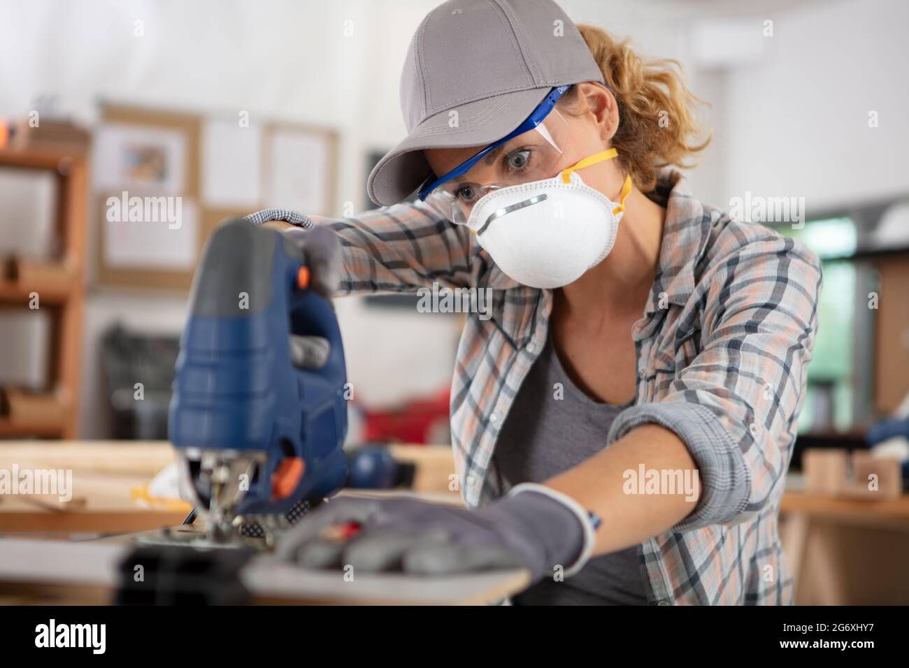 beautiful female woodworker wood sanding Stock Photo - Alamy