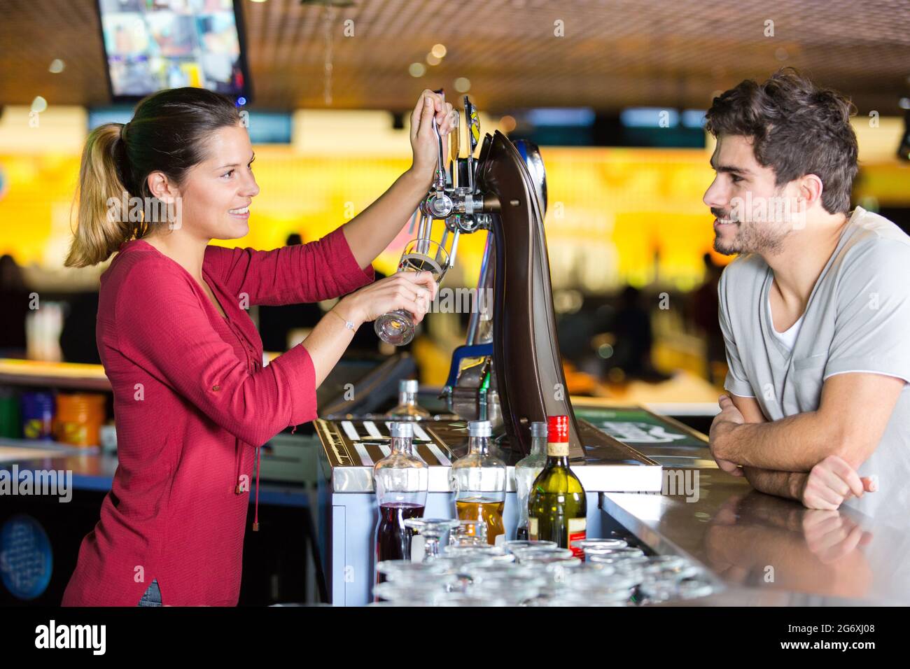 Young working class man in bar hi-res stock photography and images - Alamy