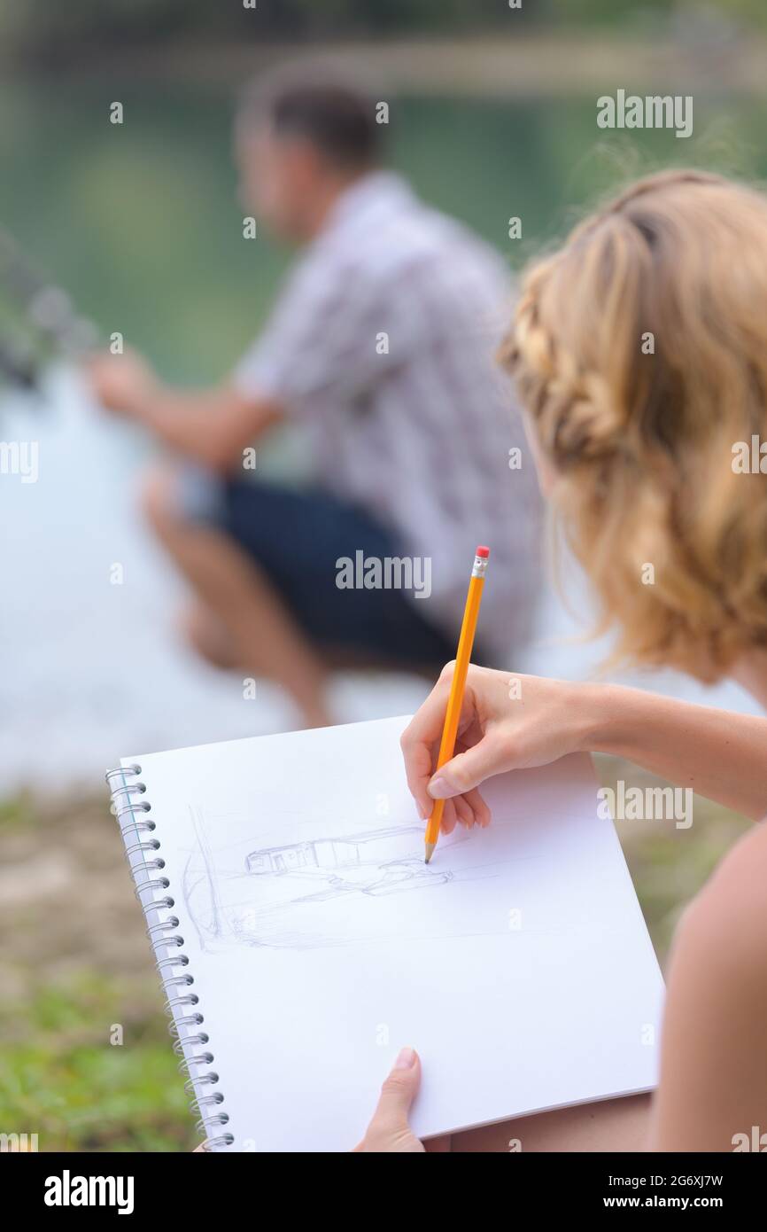 Young woman drawing landscape hi-res stock photography and images - Alamy