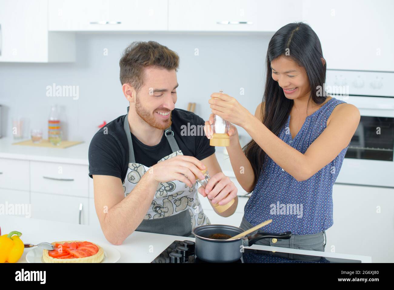 a couple is cooking together Stock Photo - Alamy
