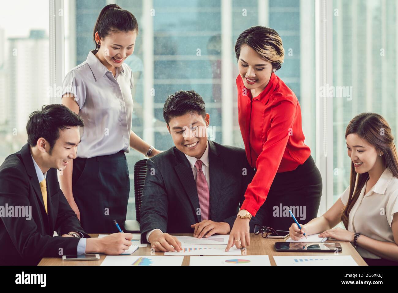Group of businesspeople sharing their smart business ideas in the ...