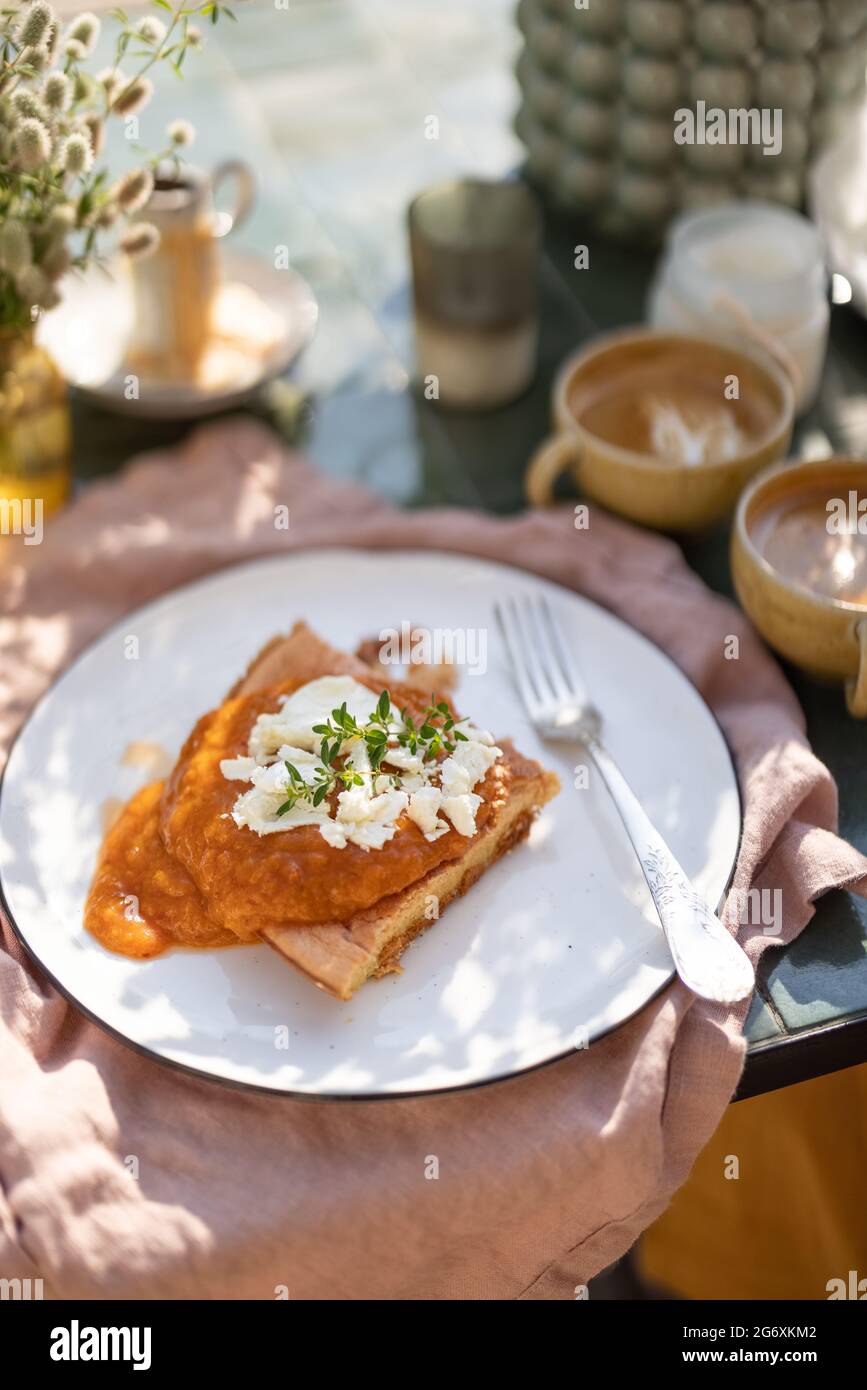 Delicious breakfast on terrace with omelette and apricot sauce and ...