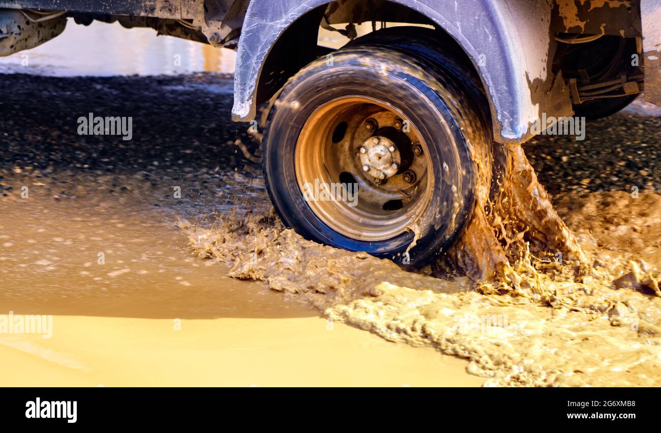 Car rides on a puddle Stock Photo - Alamy