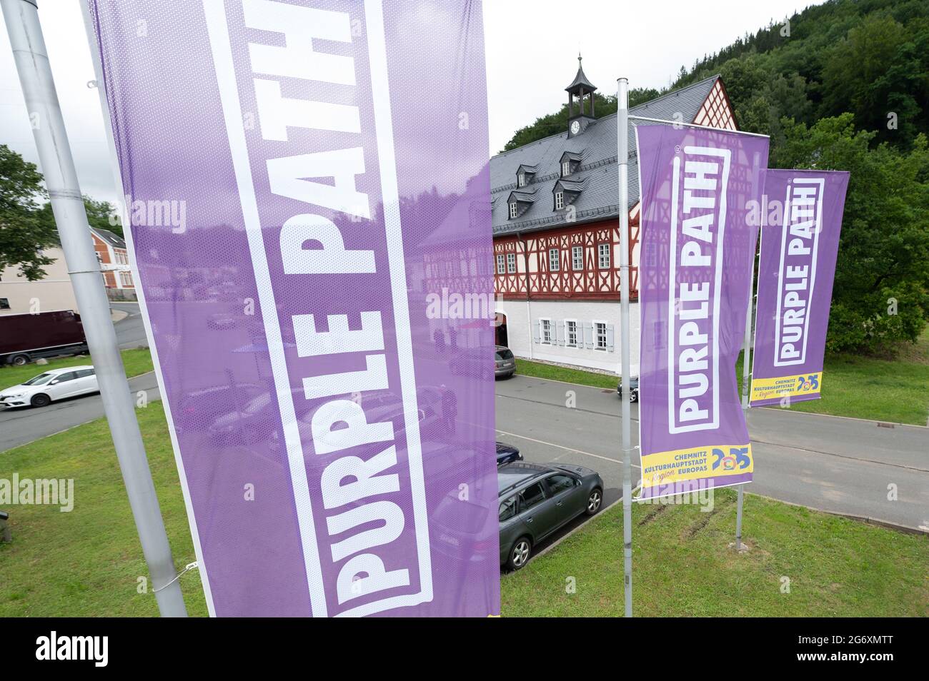 Aue, Germany. 09th July, 2021. Flags with the words "Purple Path" hang ...
