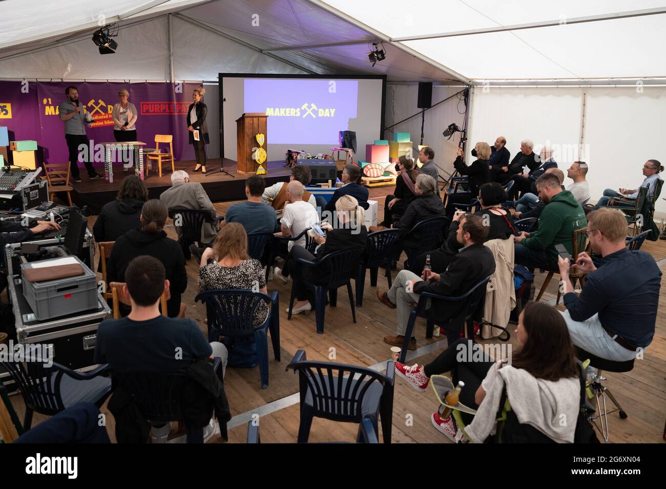 Aue, Germany. 09th July, 2021. Participants sit in a tent in front of ...