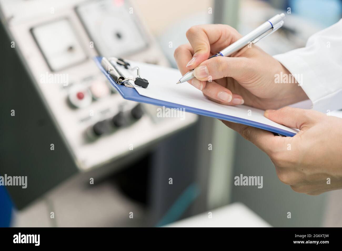 Side view close-up of the hands of a female engineer or inspector ...