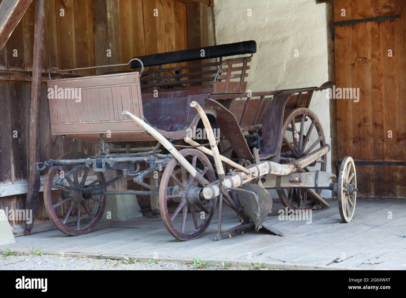 Old rusty wooden carriage in the balcony Stock Photo - Alamy