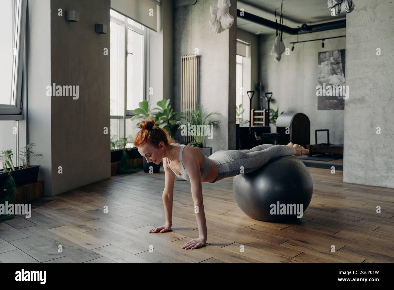 Woman balancing ball hi-res stock photography and images - Alamy