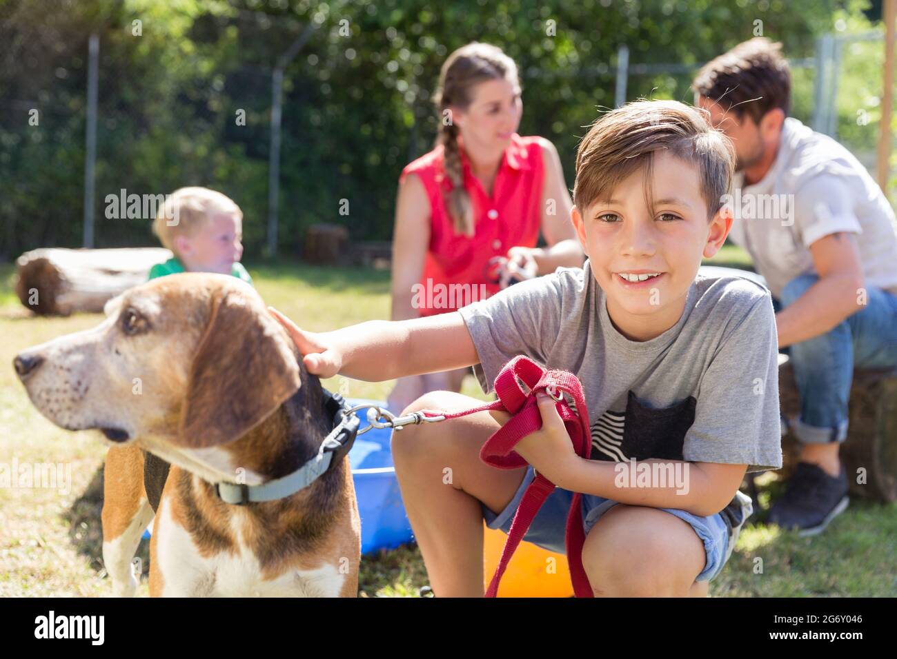 Family taking home a dog from the animal shelter giving new home ...