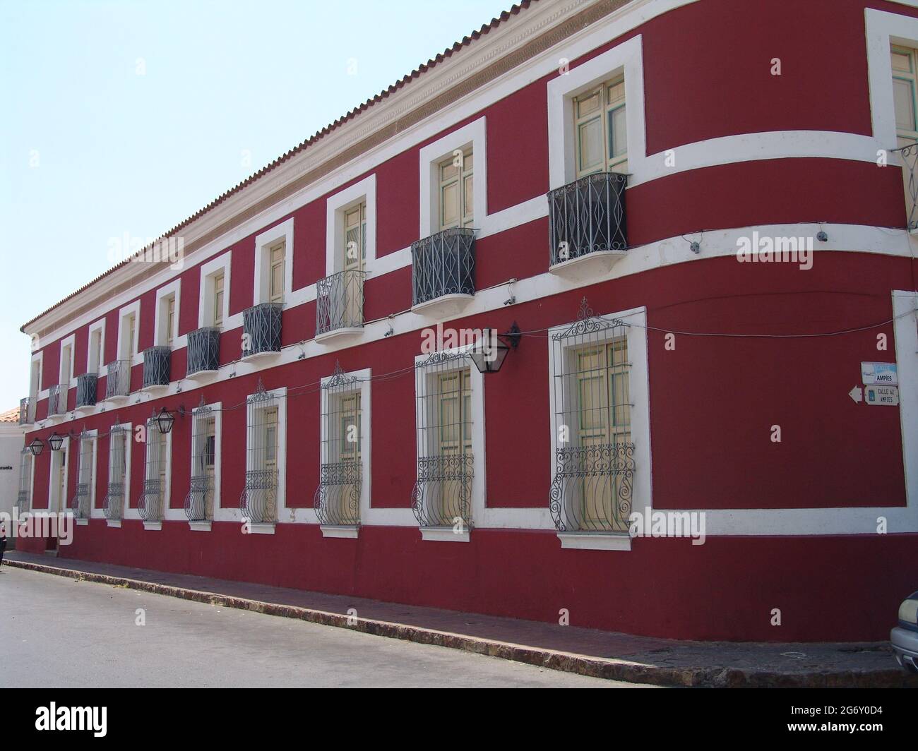 Red-white two storey building under a clear sky in the center of Coro ...