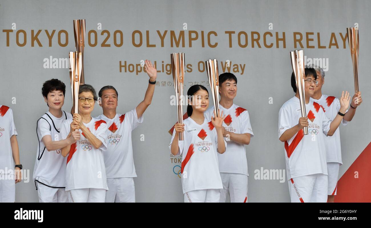 Tokyo, Japan. 09th July, 2021. Torchbearers pose for the cameras during ...