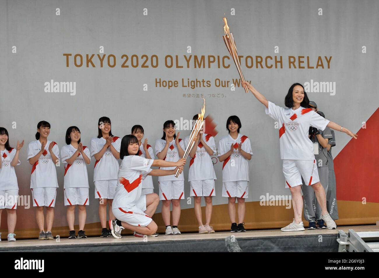 Tokyo, Japan. 09th July, 2021. Torchbearers pose for the cameras during ...