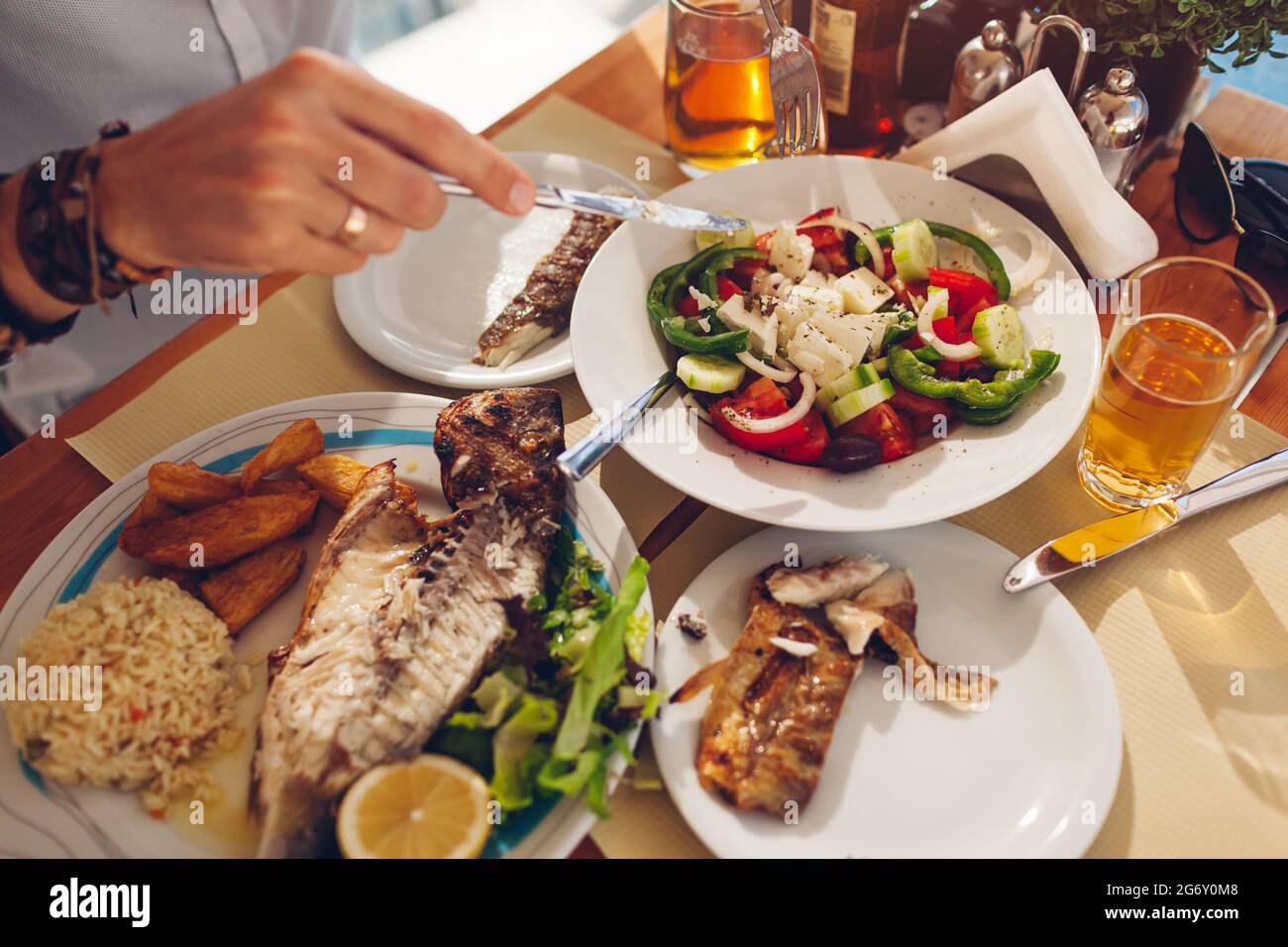 Man eating fish at restaurant hi-res stock photography and images - Alamy