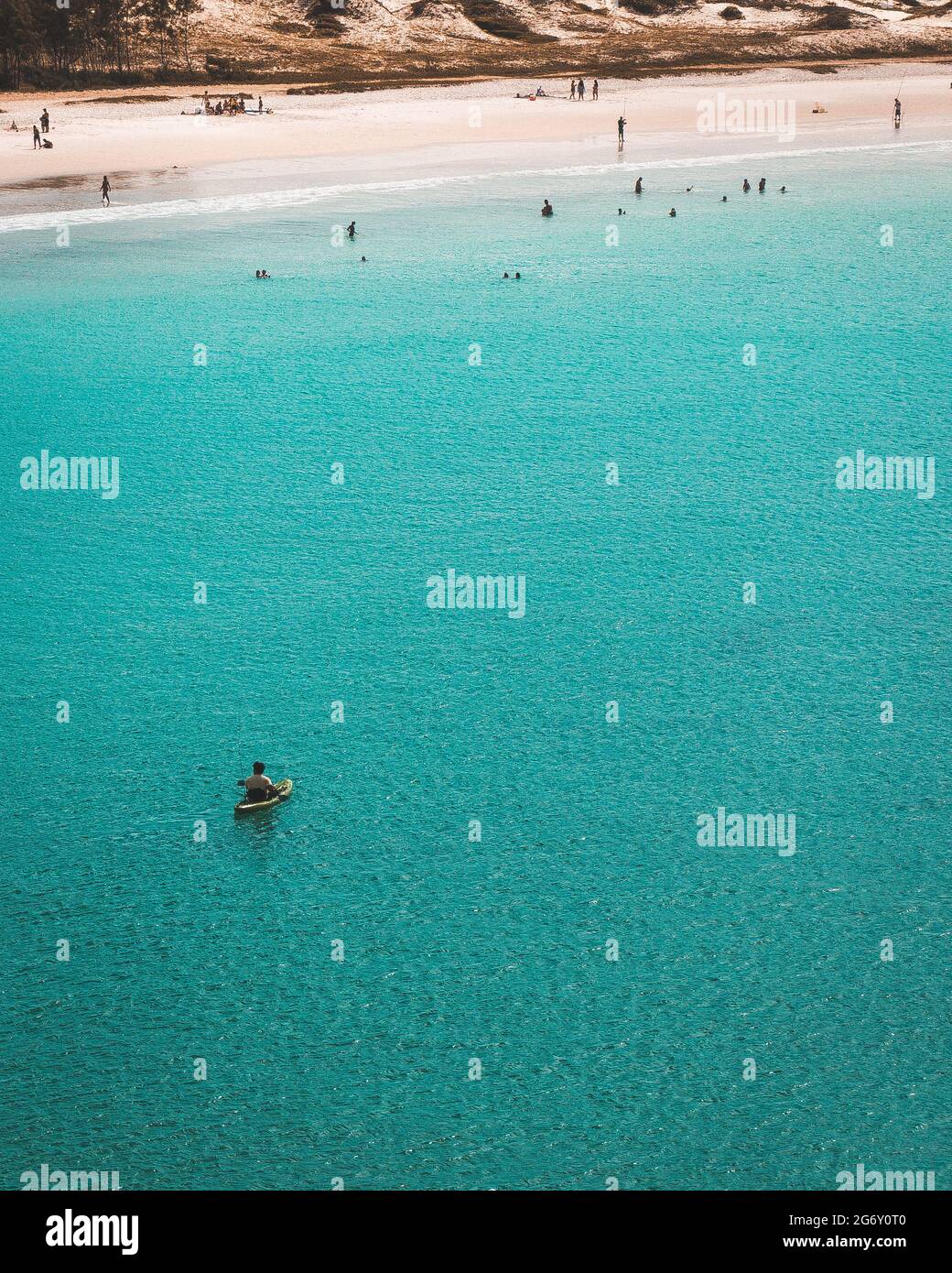 Scenic view of tourists on the beautiful shoreline at summertime Stock ...