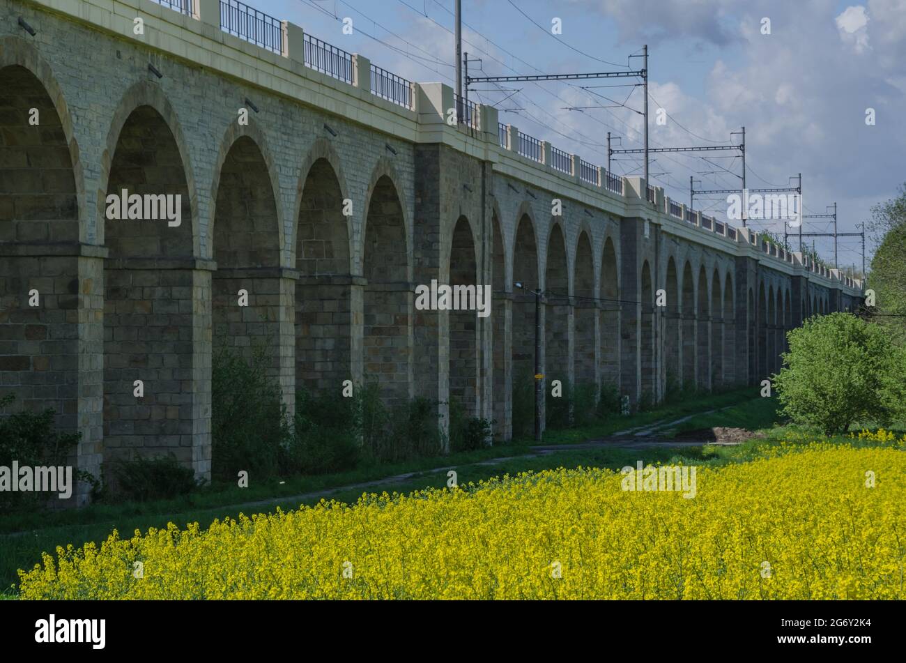 Beautiful scene of viaduct type of bridge surrounded by green fields ...