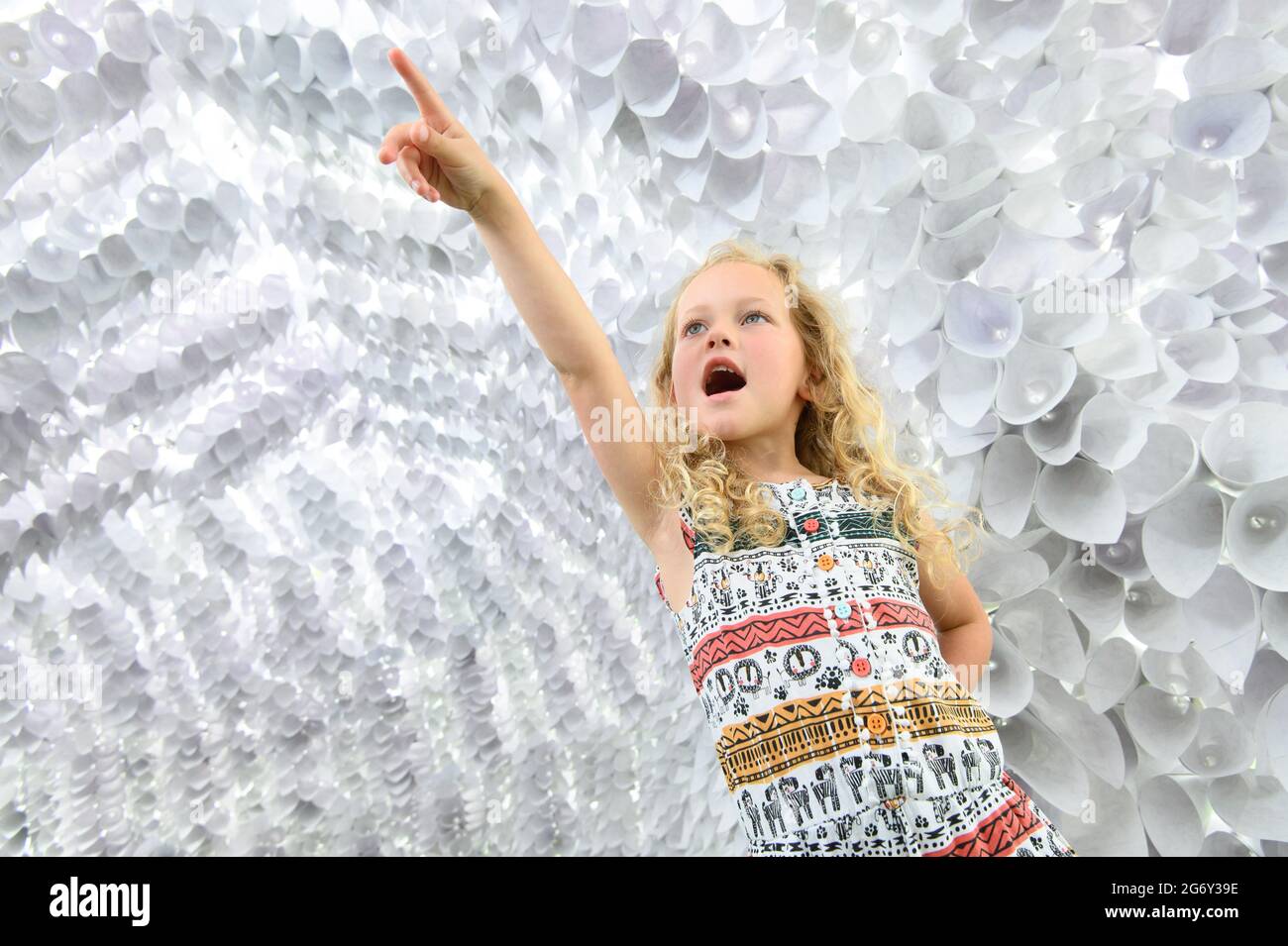 EDITORIAL USE ONLY Amelie, aged 5, (surname not given) enjoys an ...