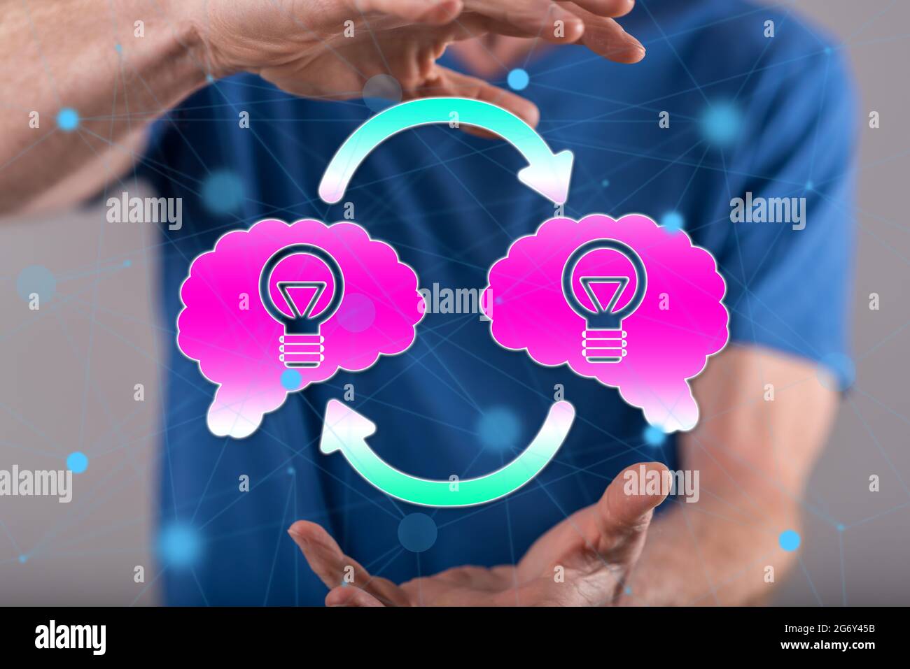 Knowledge sharing concept between hands of a man in background Stock ...