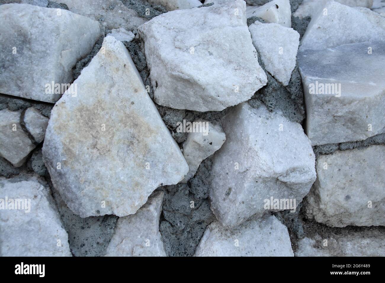 wall of white large stone with cement Stock Photo - Alamy