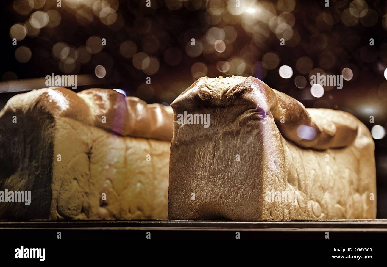 new bread on bakery shop on night light reflex on mirror Stock Photo ...