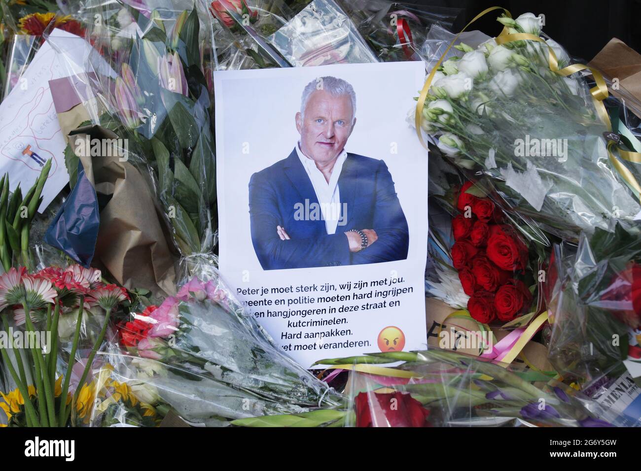 A picture of the Dutch journalist Peter R de Vries and flowers placed ...