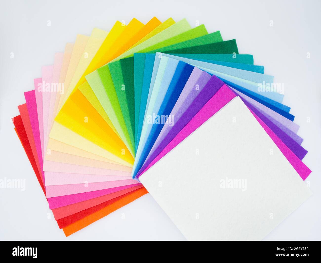 The square pieces of felt spread out by a color spectrum on similarity ...