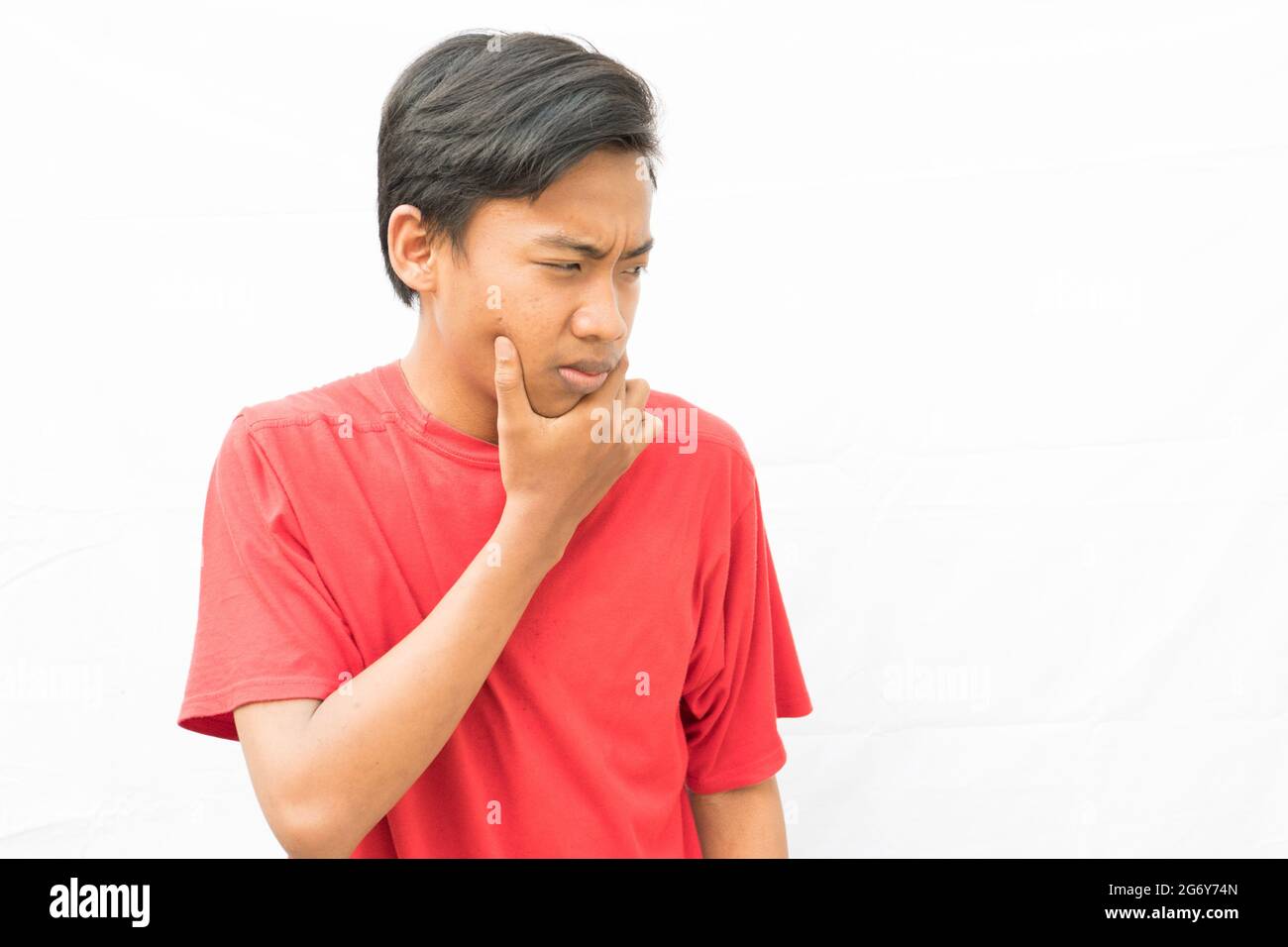 Portrait of an Indonesian thinking male Stock Photo - Alamy