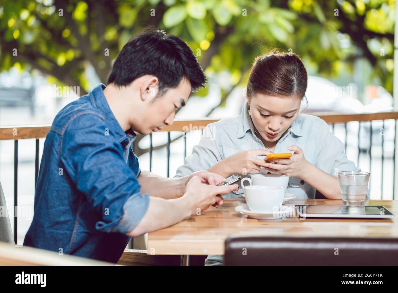 Couple busy in using hi-res stock photography and images - Alamy