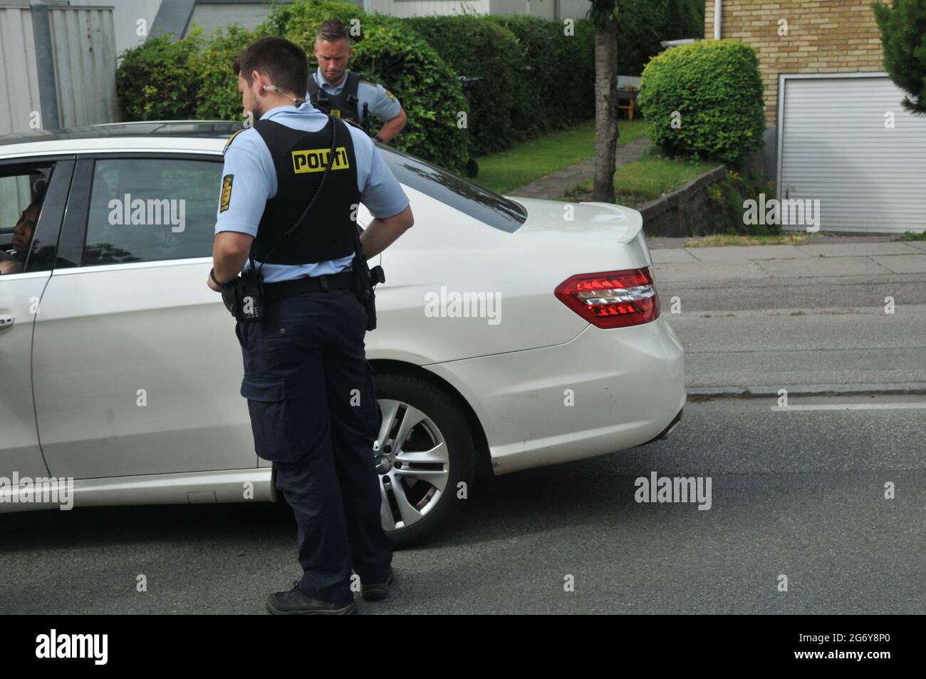 Copenhagen, Denmark. 09 July 2021, Danish police officer checking auto ...