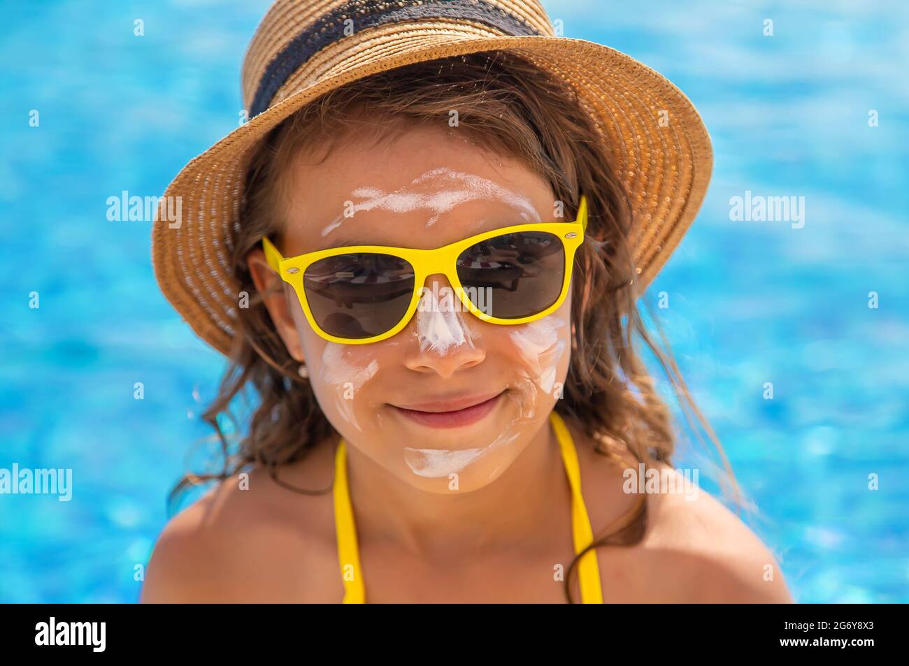Kid putting on lotion hi-res stock photography and images - Alamy