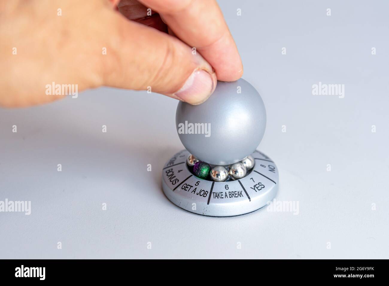 hand spinning the wheel of opportunity, pointer on GET A JOB ...