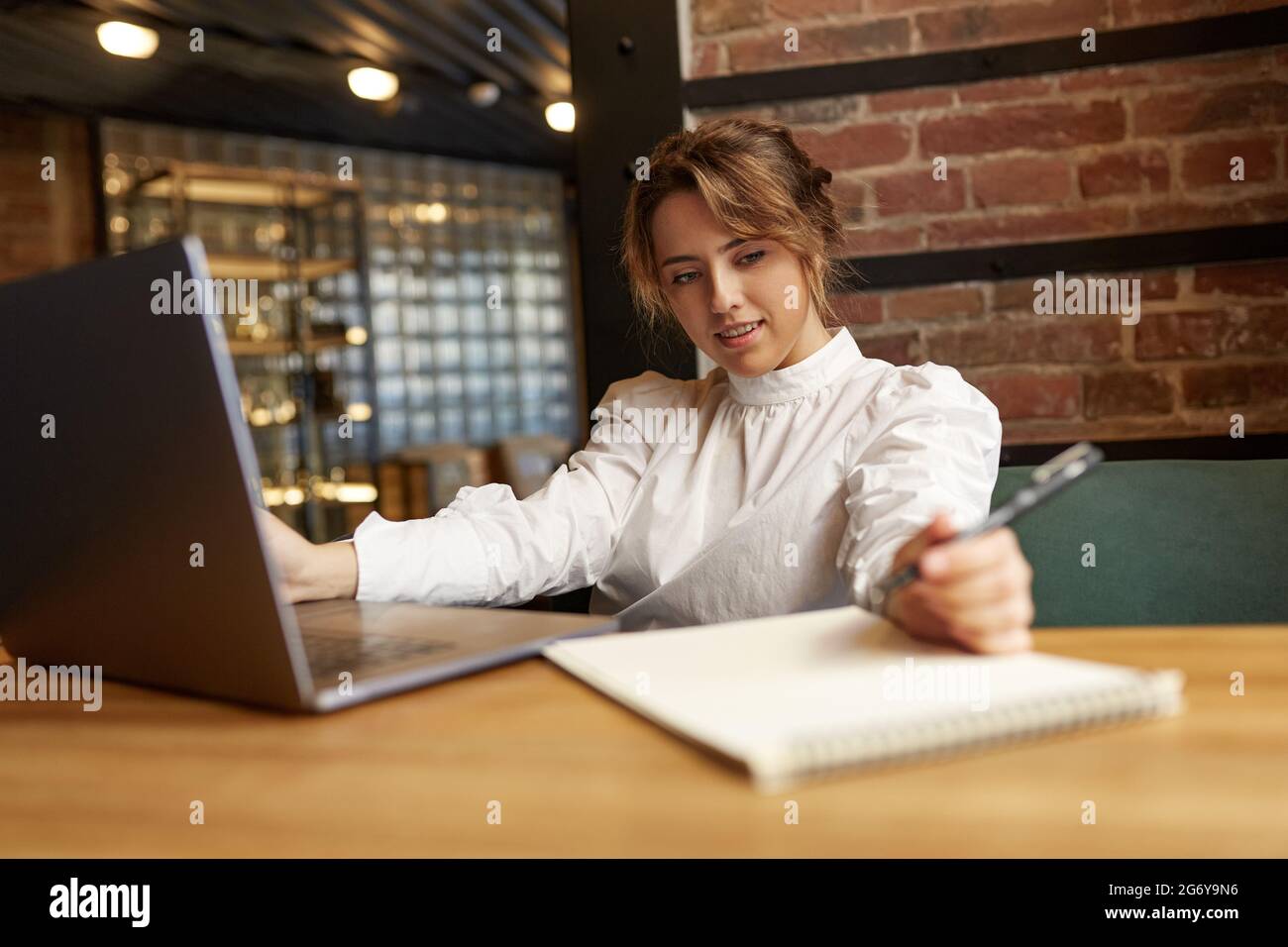 Young woman taking notes typing hi-res stock photography and images - Alamy