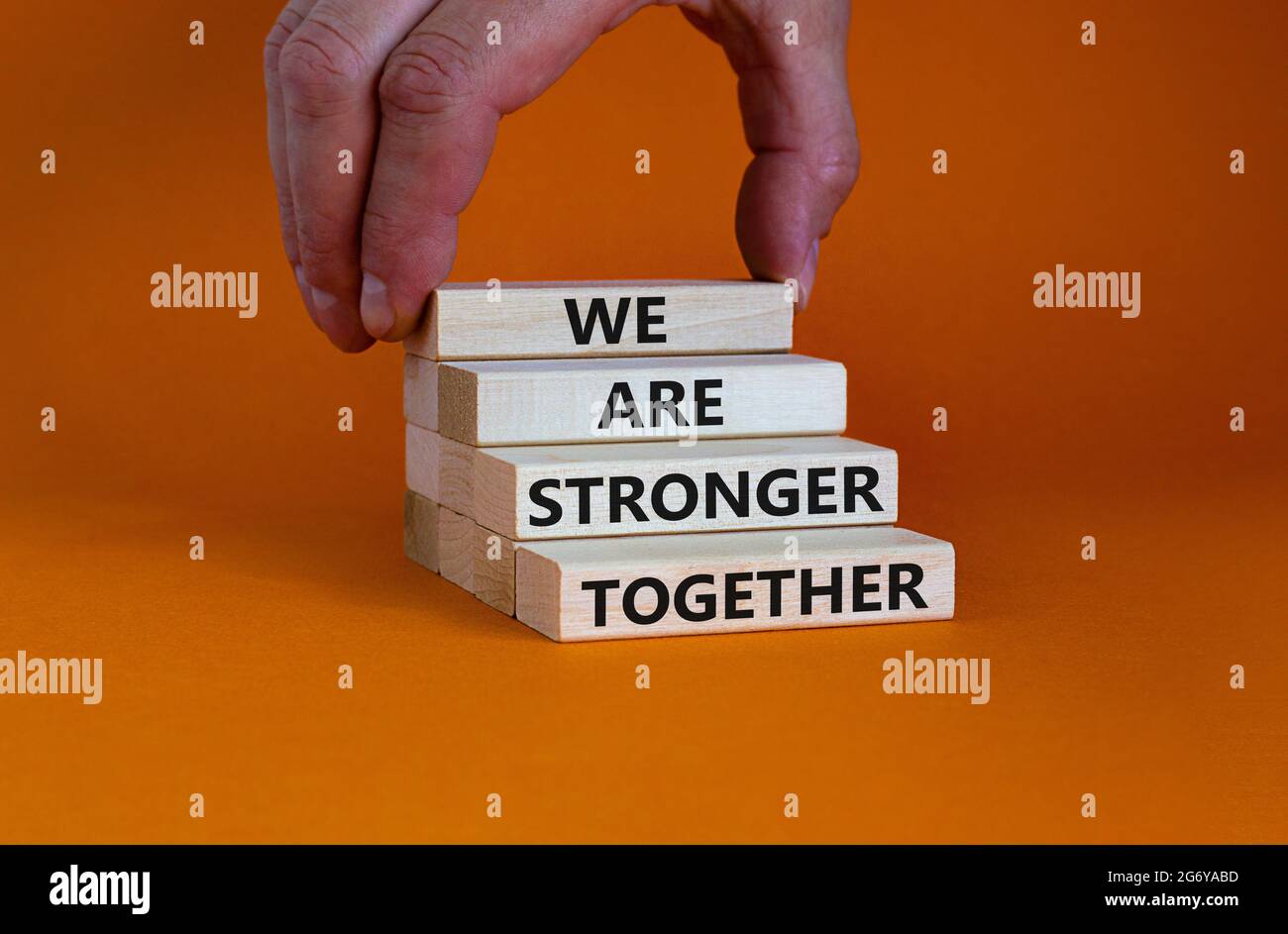 Stronger together symbol. Wooden block with words 'we are stronger ...